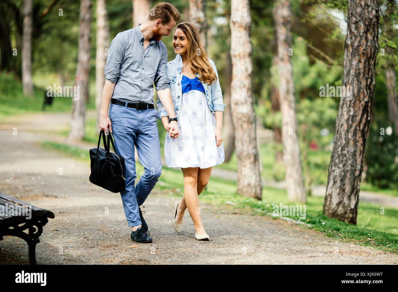 Beautiful couple taking a walk in nature Stock Photo - Alamy