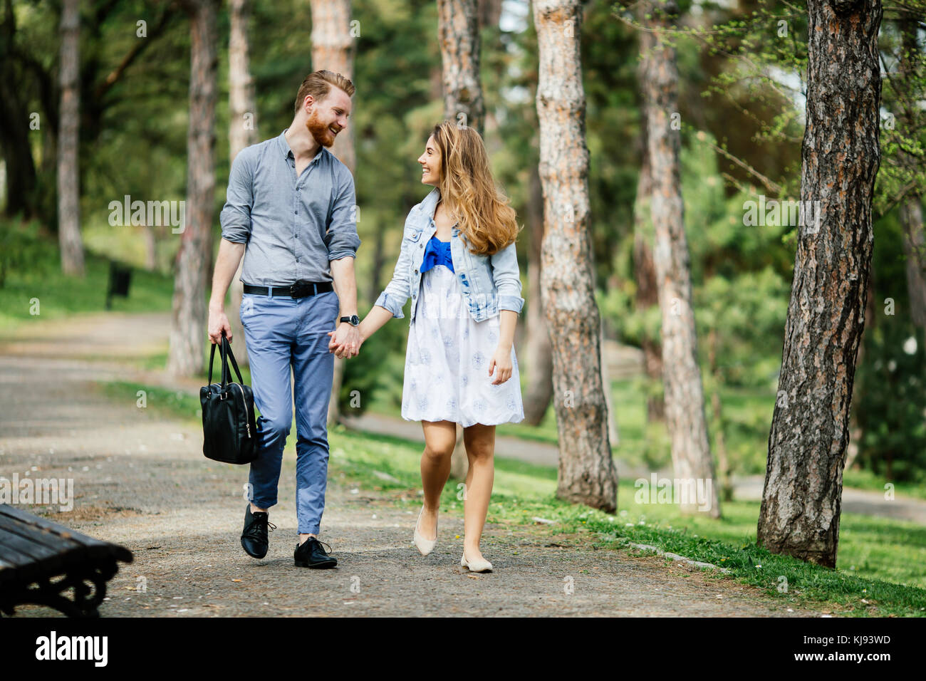 Beautiful couple taking a walk in nature Stock Photo - Alamy