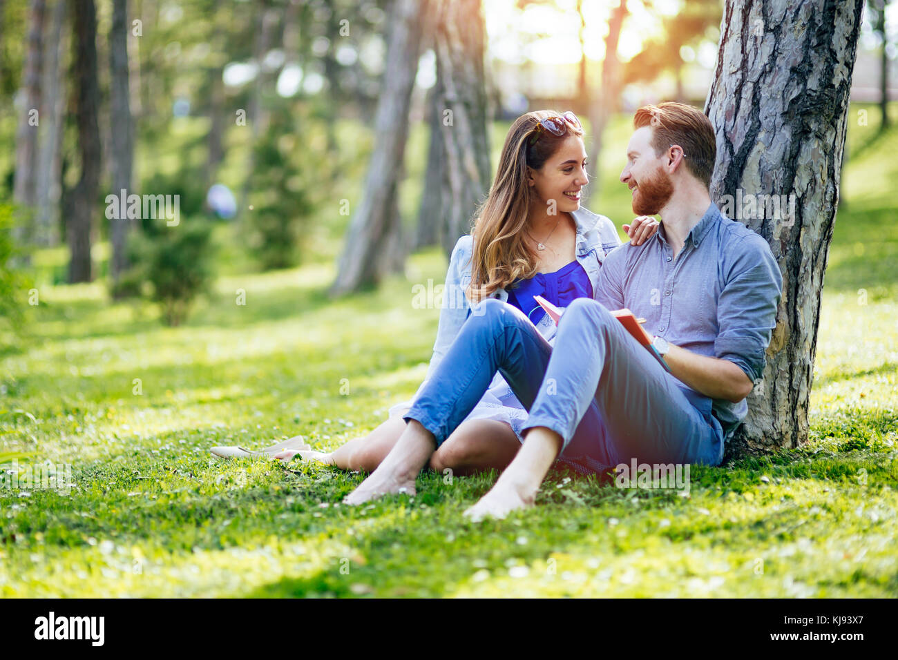 Cute uni students studying together Stock Photo - Alamy