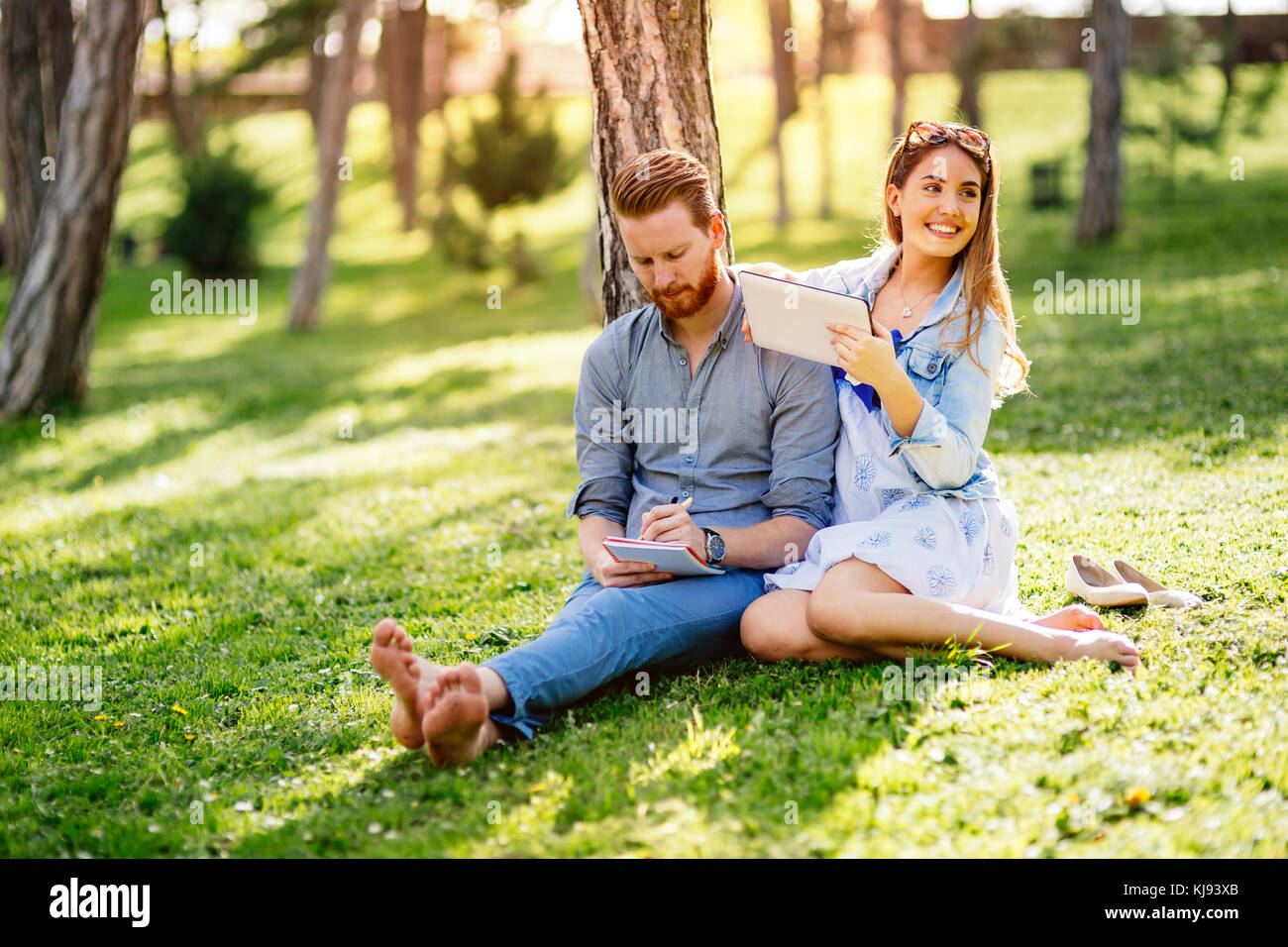 Cute university students studying Stock Photo - Alamy