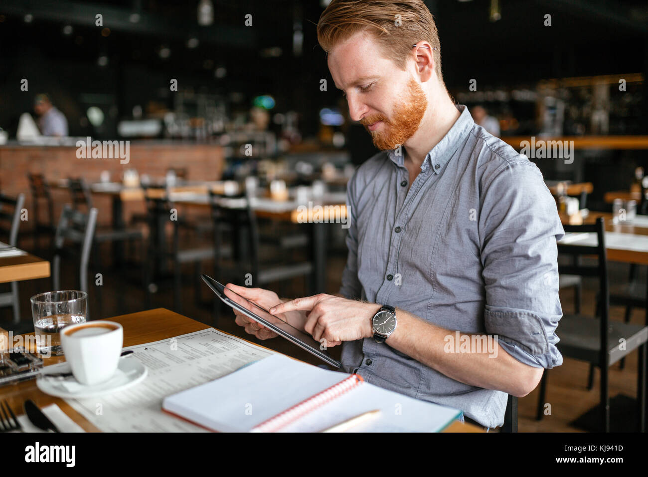 Businessman taking notes Stock Photo - Alamy