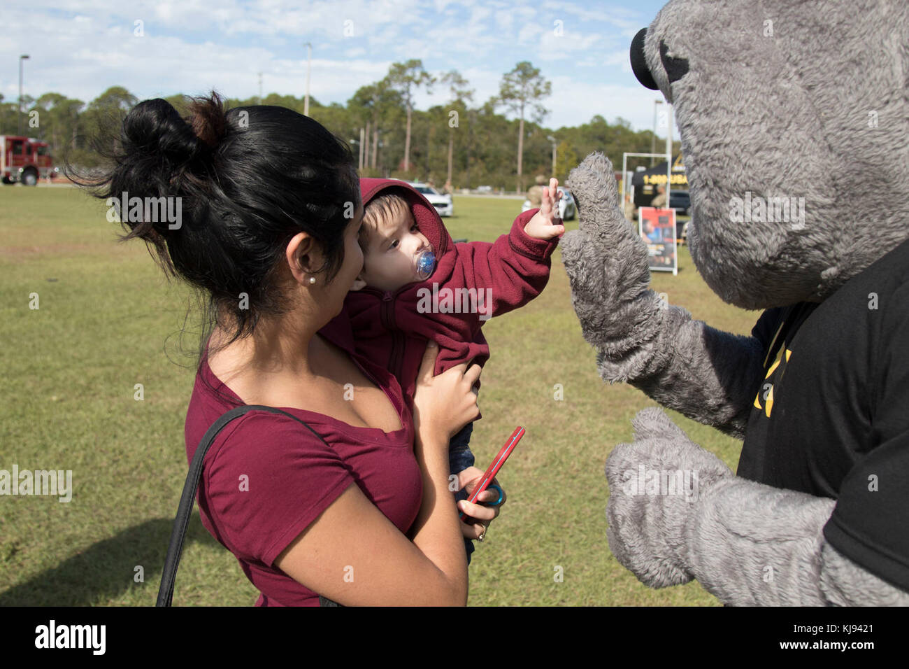 Sgt. Rocky, 3rd Infantry Division's mascot, high fives Leonardo during ...