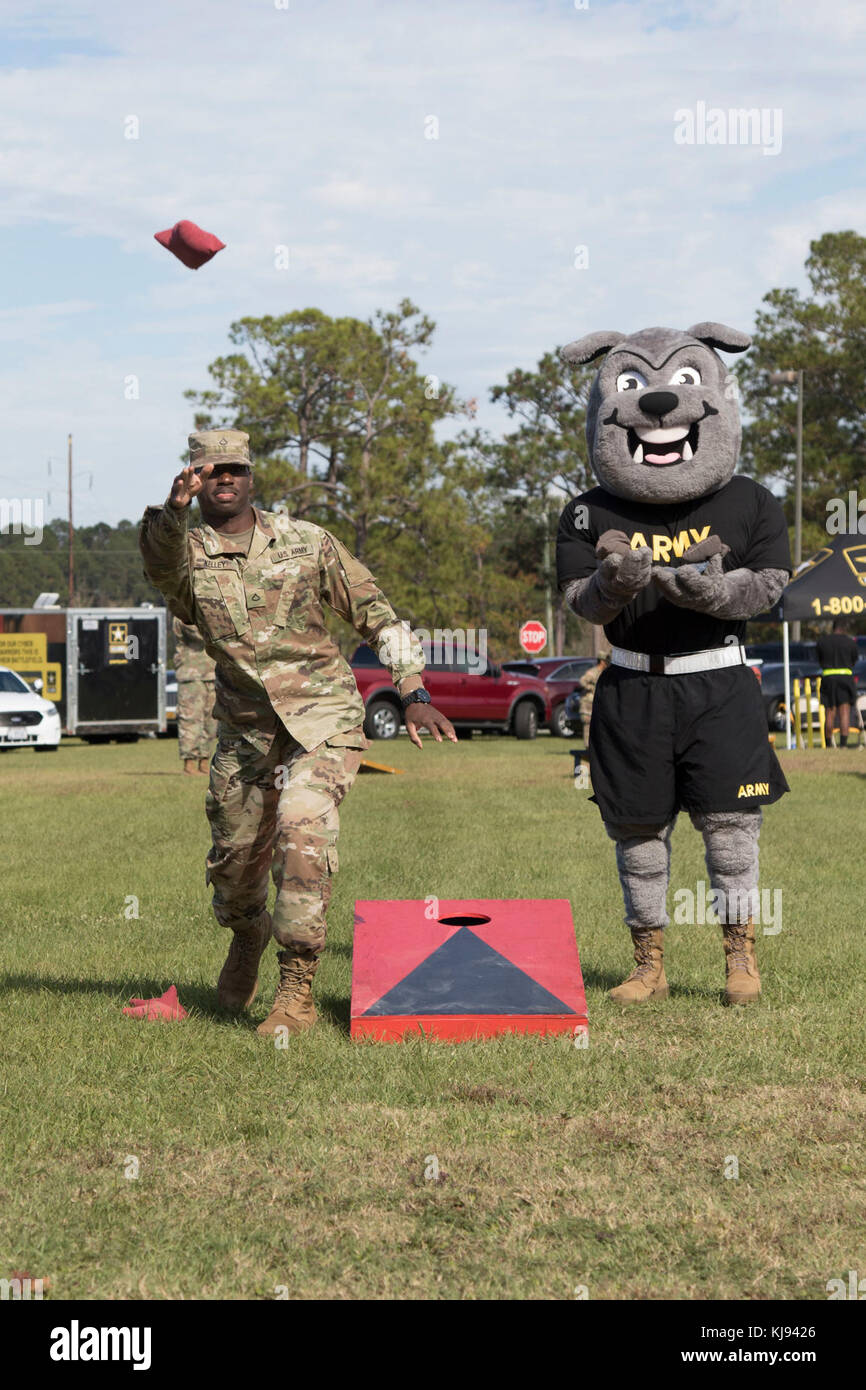 Sgt. Rocky, 3rd Infantry Division's mascot, plays a bean bag toss game ...