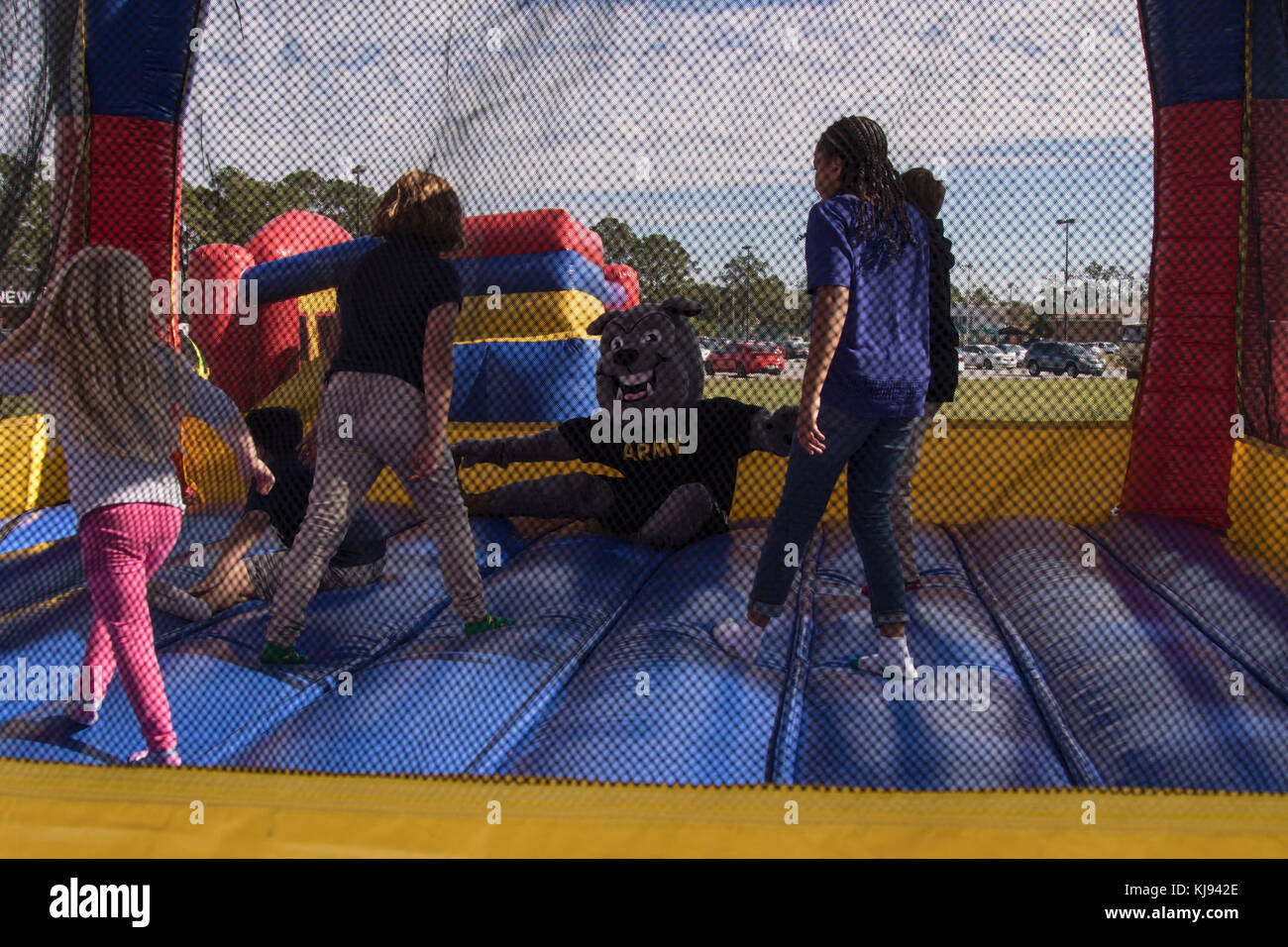 Sgt. Rocky, 3rd Infantry Division's mascot, shows kids the proper way ...