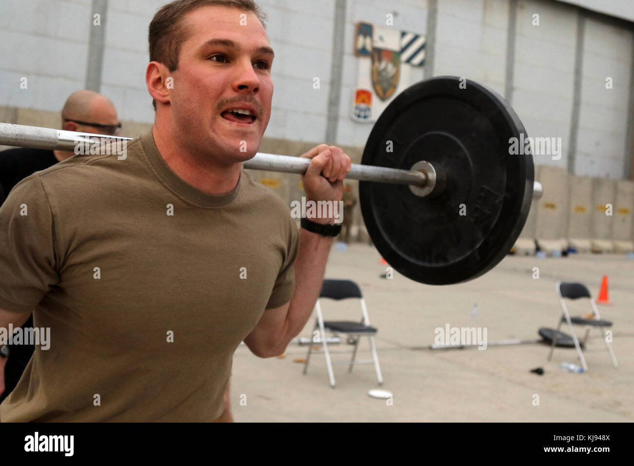 BAGRAM AIRFIELD, Afghanistan - A servicemember completes a squat ...