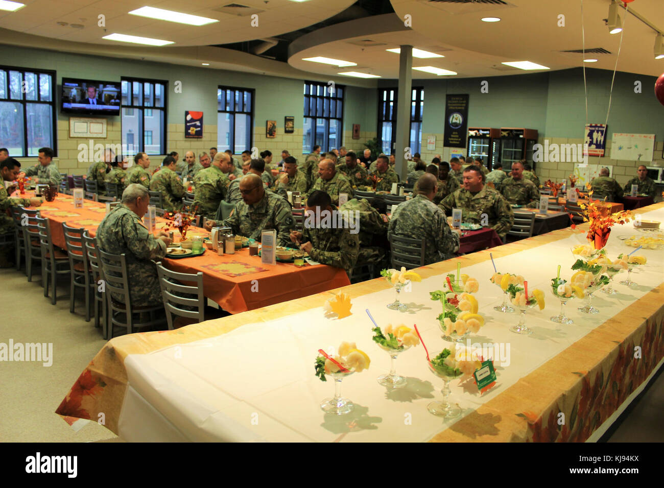 A table full of desserts is shown during an early Thanksgiving meal for ...