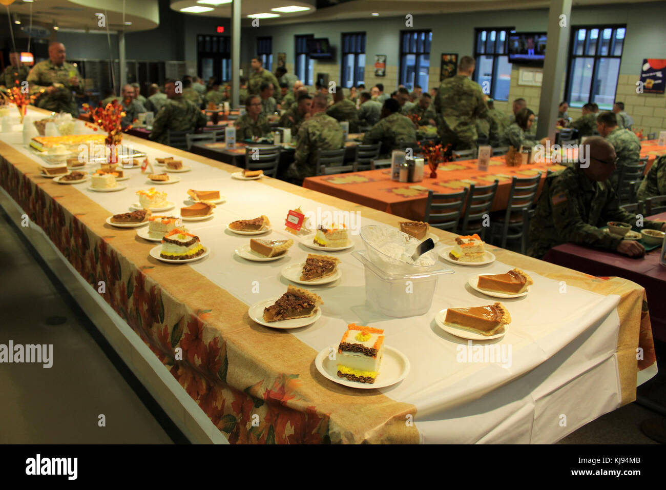A table full of desserts is shown during an early Thanksgiving meal for ...