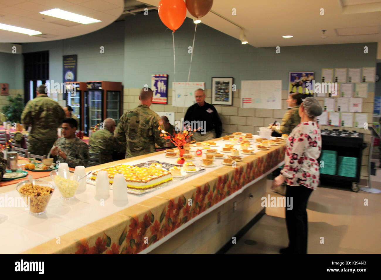 A table full of desserts is shown during an early Thanksgiving meal for ...