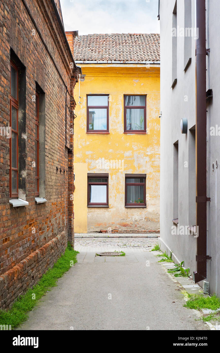 Narrow alley in old town. Summertime in the city Stock Photo - Alamy