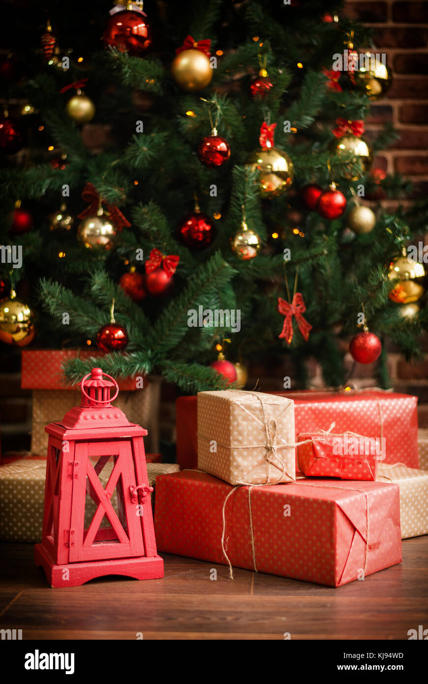 Boxes with Christmas gifts under the tree Stock Photo - Alamy
