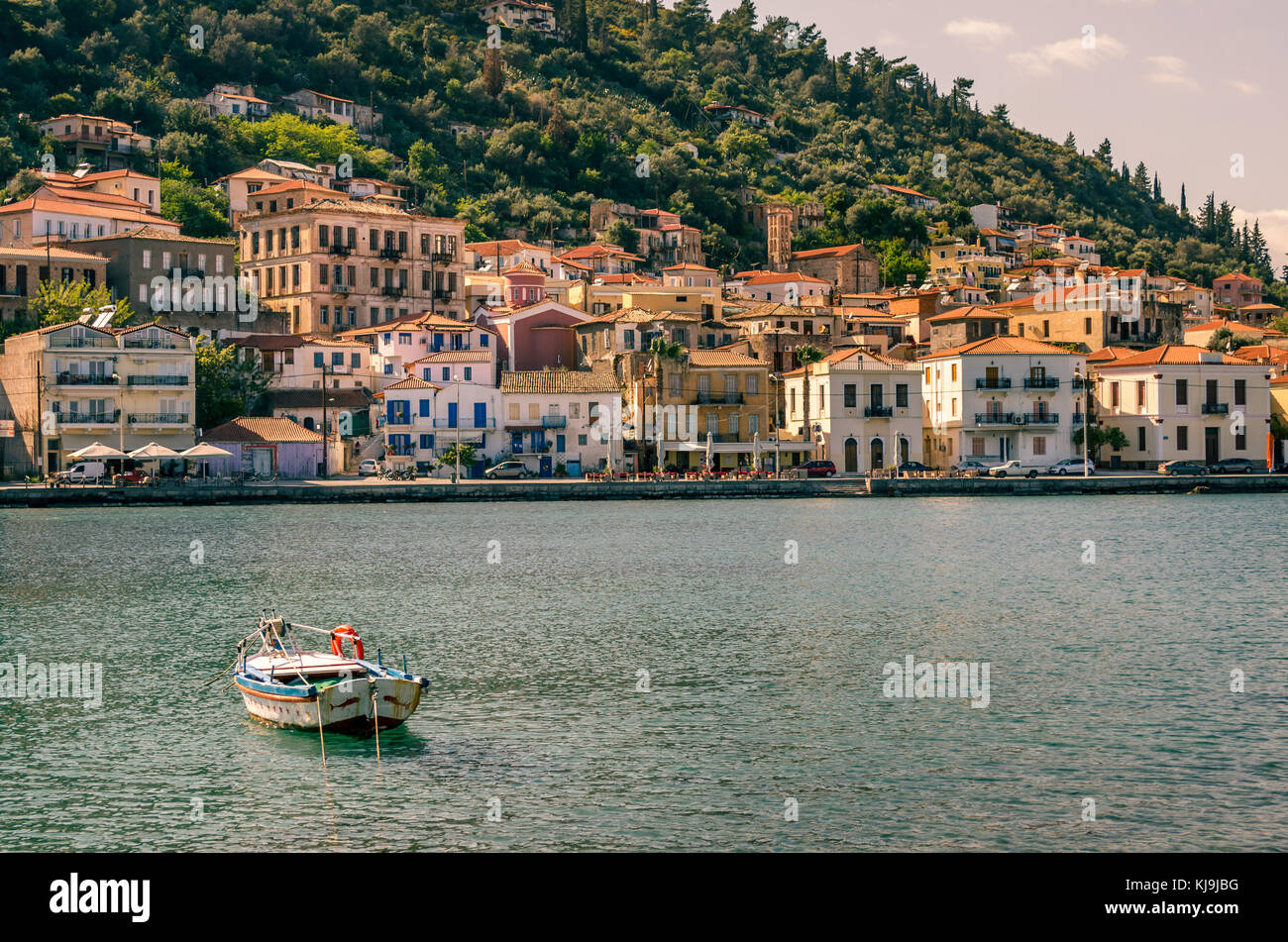 view of the traditional village of Githio with a fishing boat in ...
