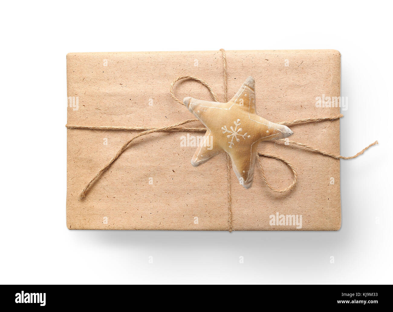 Christmas gift box wrapped in brown recycled paper and tied sack rope ...