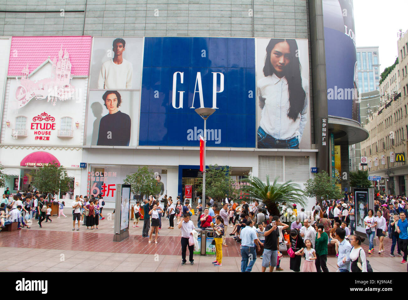 People walk past the Gap Store on Nanjing Road in Shanghai, China Stock ...