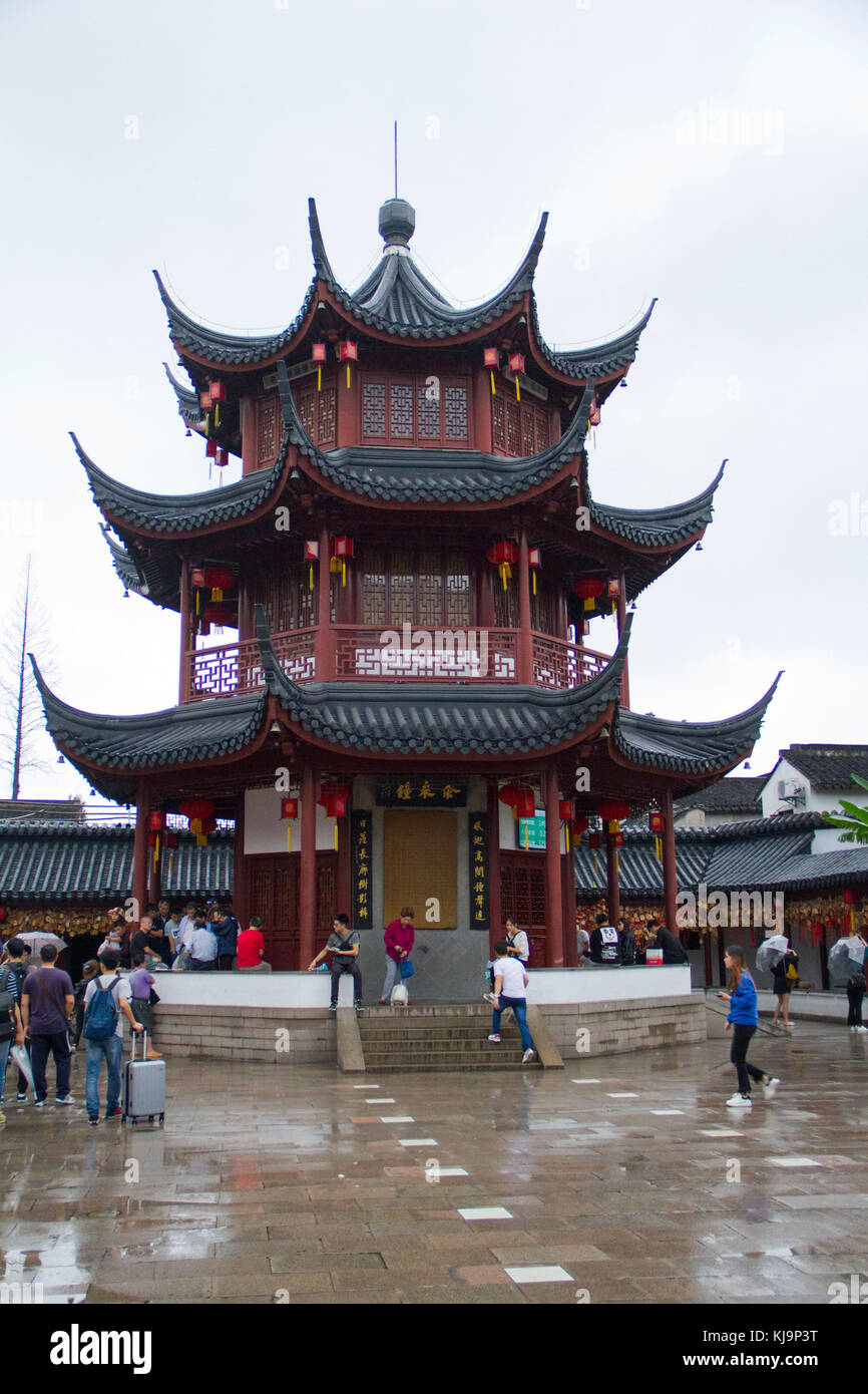 People walk through the ancient settlement of Qabio in the Minhang ...