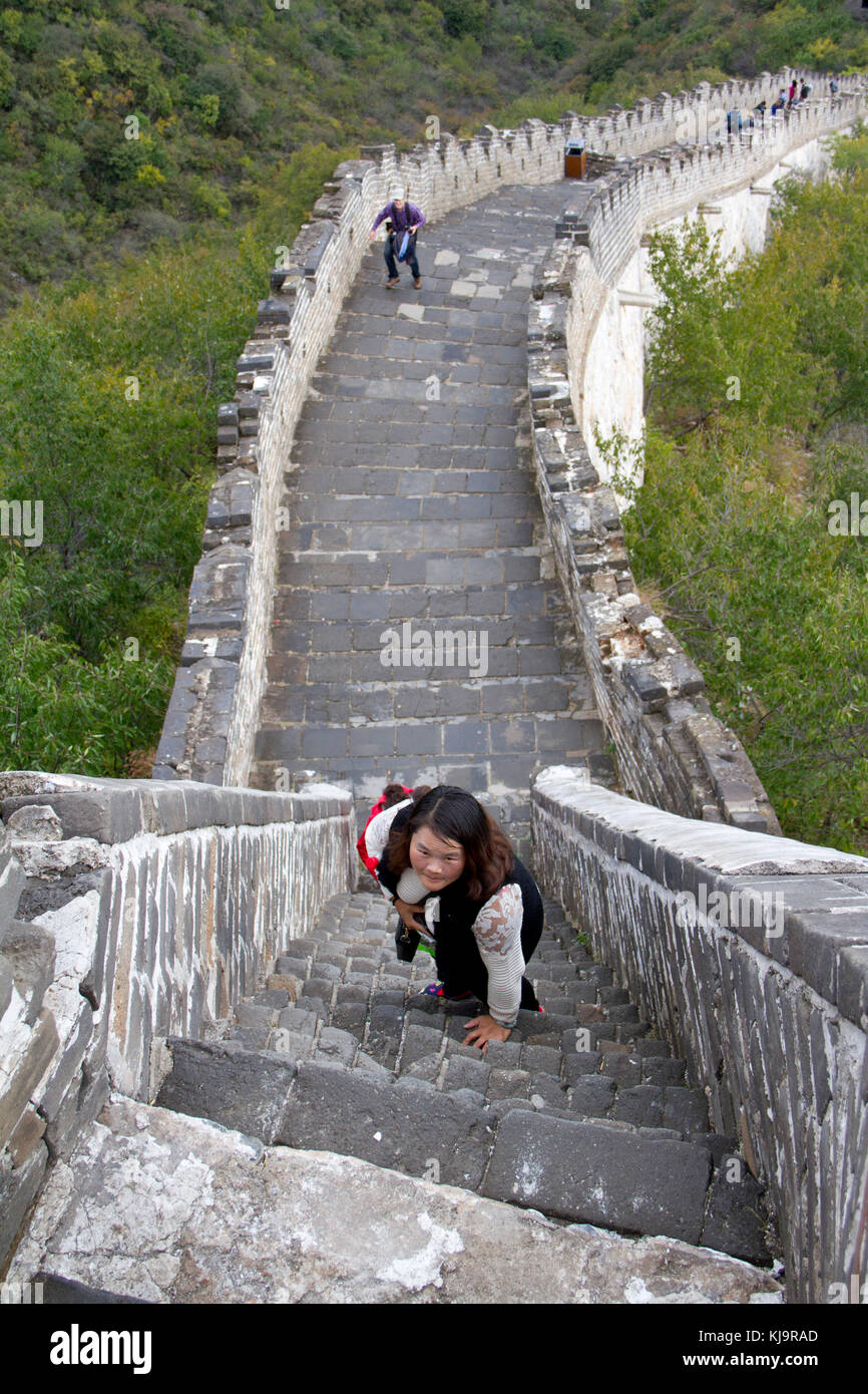 People walk on the Mutianyu section of the Great Wall of China in ...