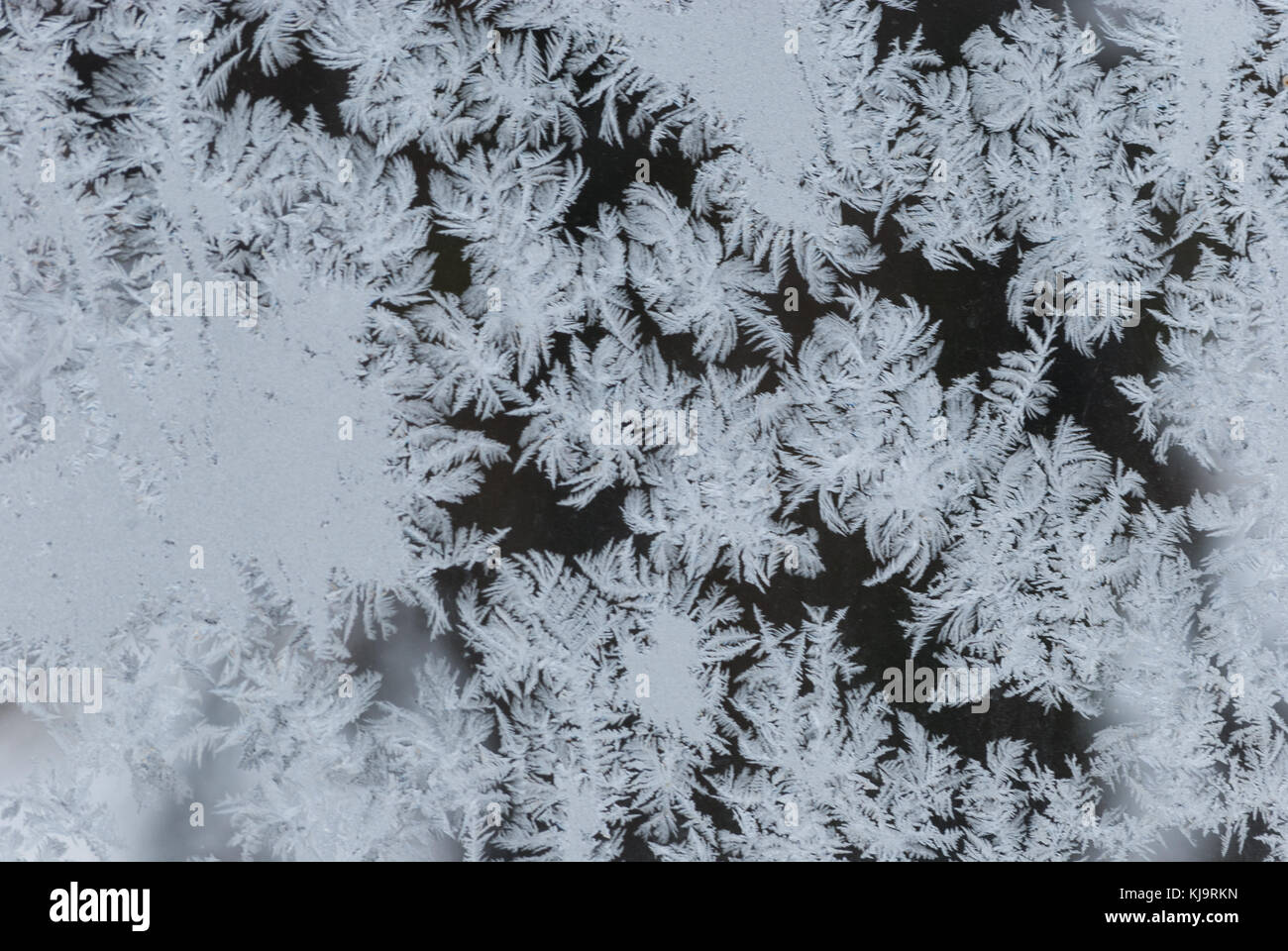 frosty patterns in the window Stock Photo - Alamy