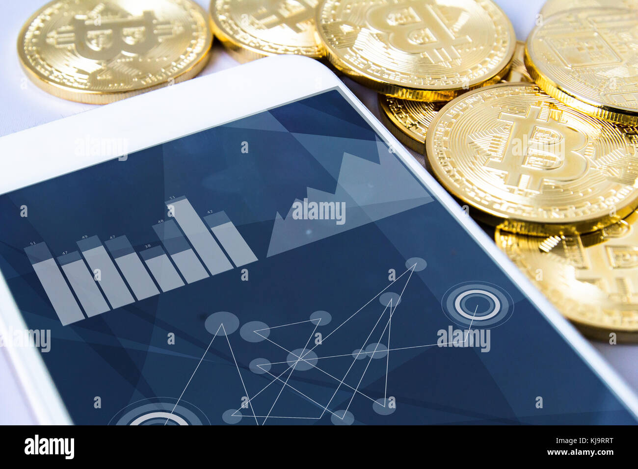 bitcoins and smartphone Stock Photo - Alamy