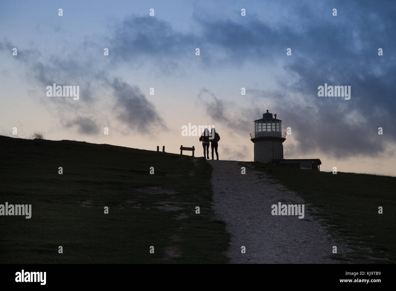 Sunset silhouettes on Beachy Head Stock Photo - Alamy