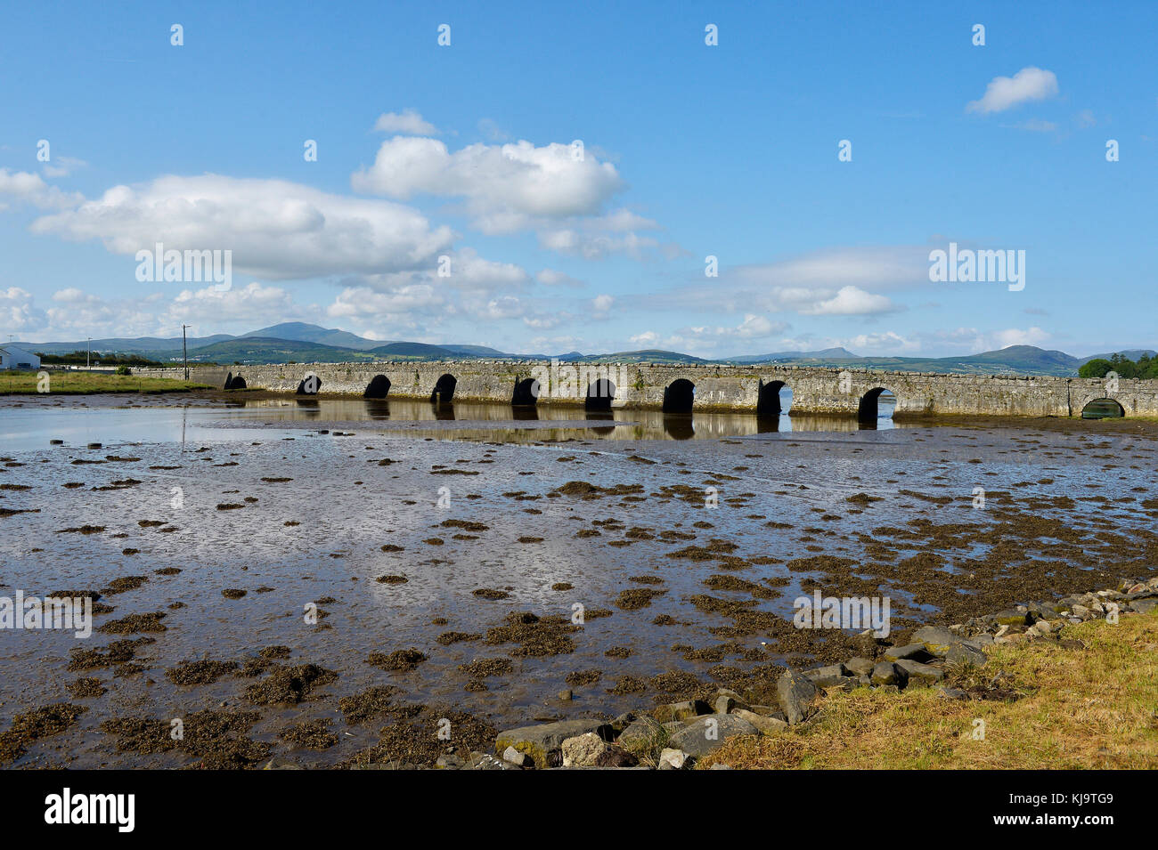 Ten arched stone bridge and River Ballyboe in Malin Town, Wild Atlantic ...