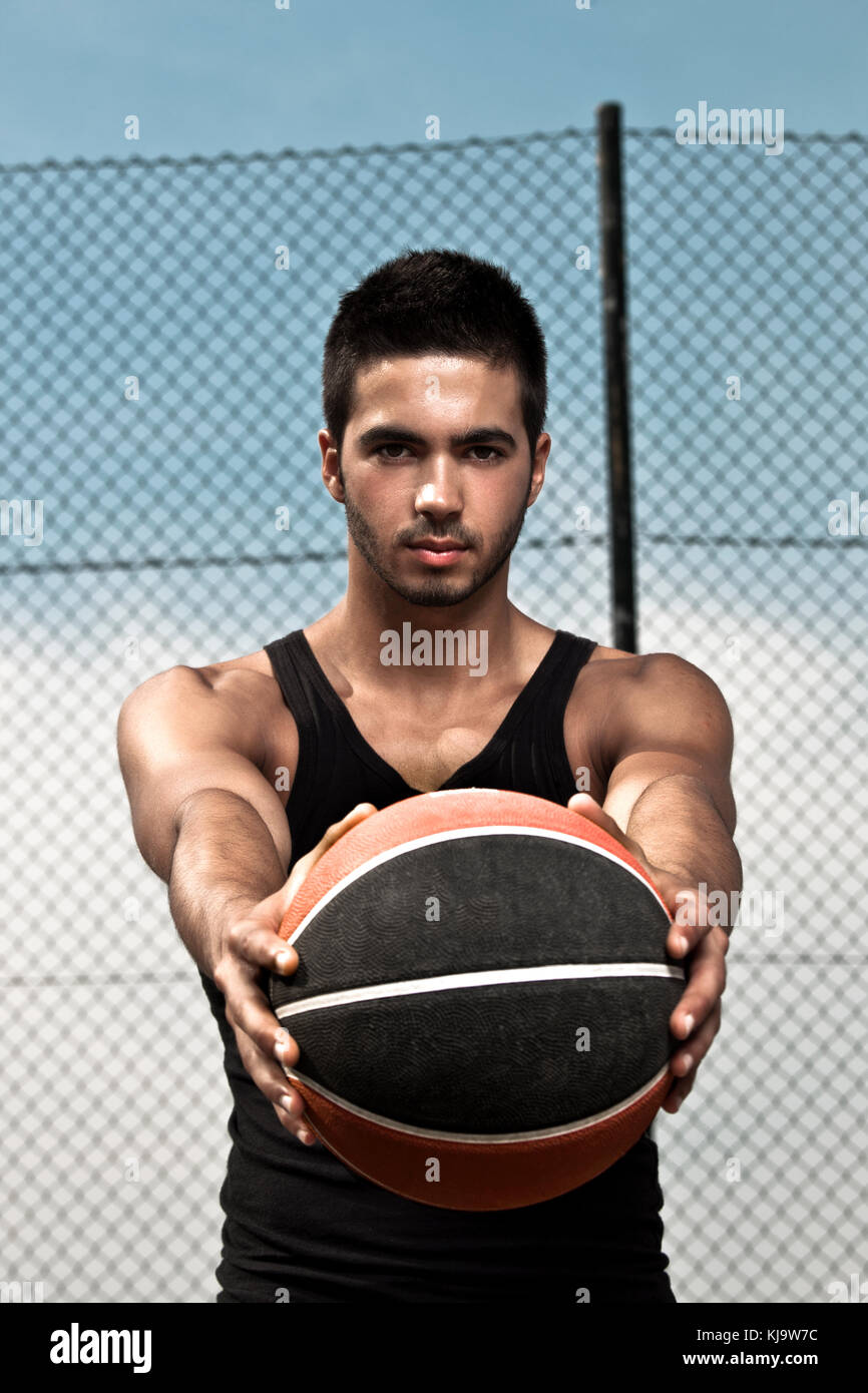 Portrait of young man street basket player Stock Photo - Alamy