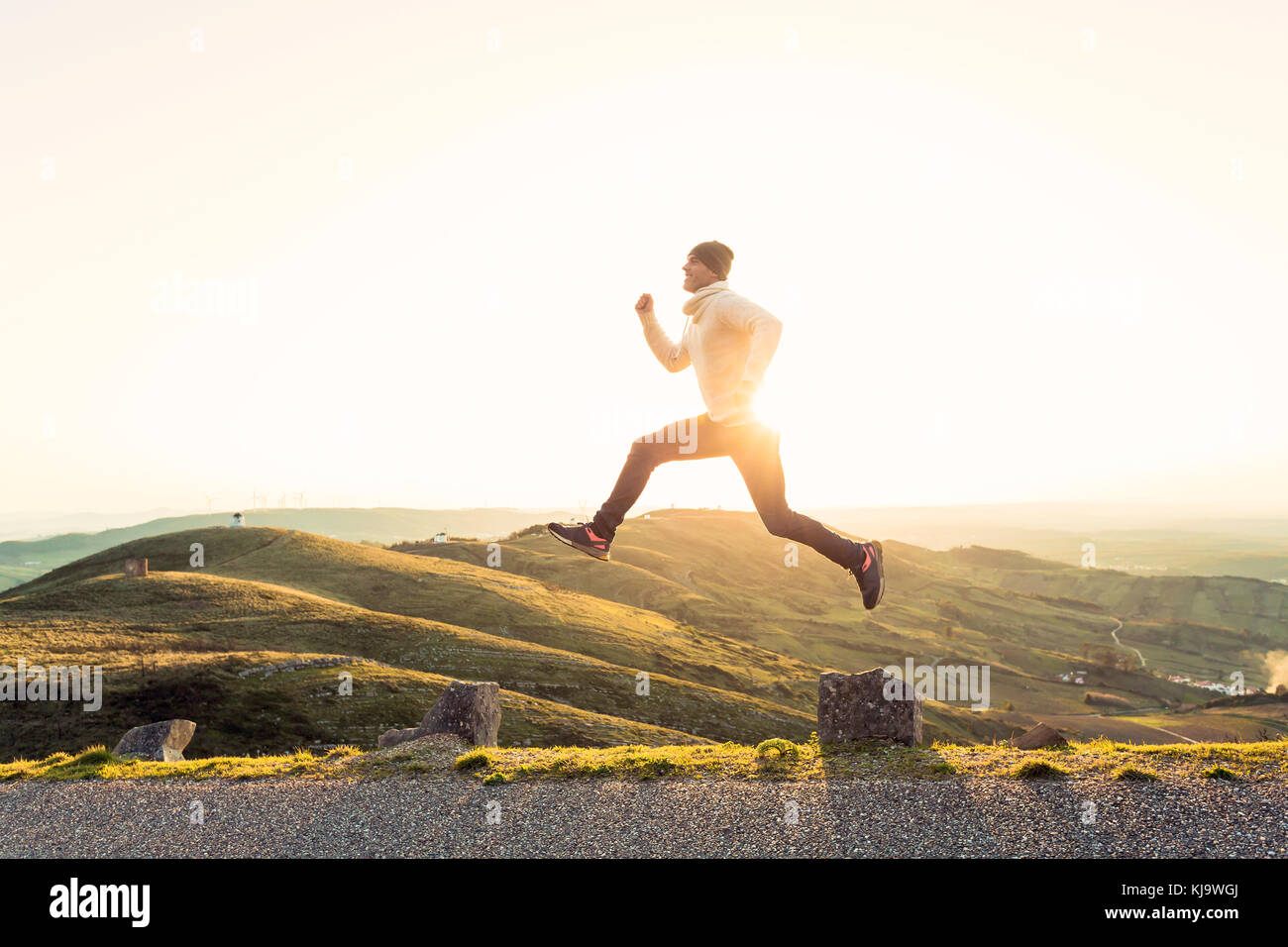 Man in outdoor running and jumping Stock Photo - Alamy