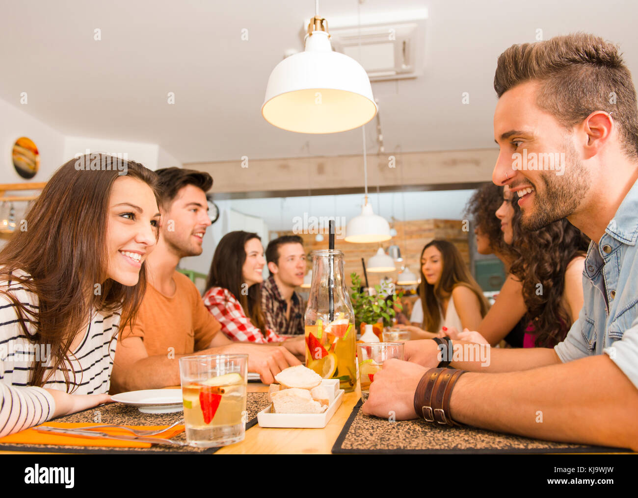 Multi-Ethnic Group of happy friends lunching and having fun at the ...