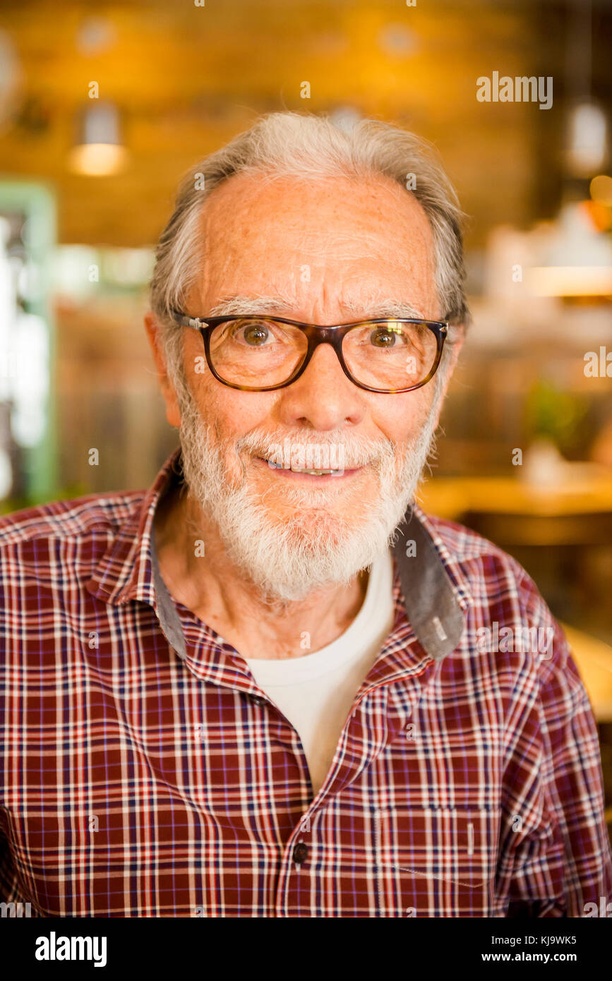 Portrait of a happy senior man smiling Stock Photo - Alamy