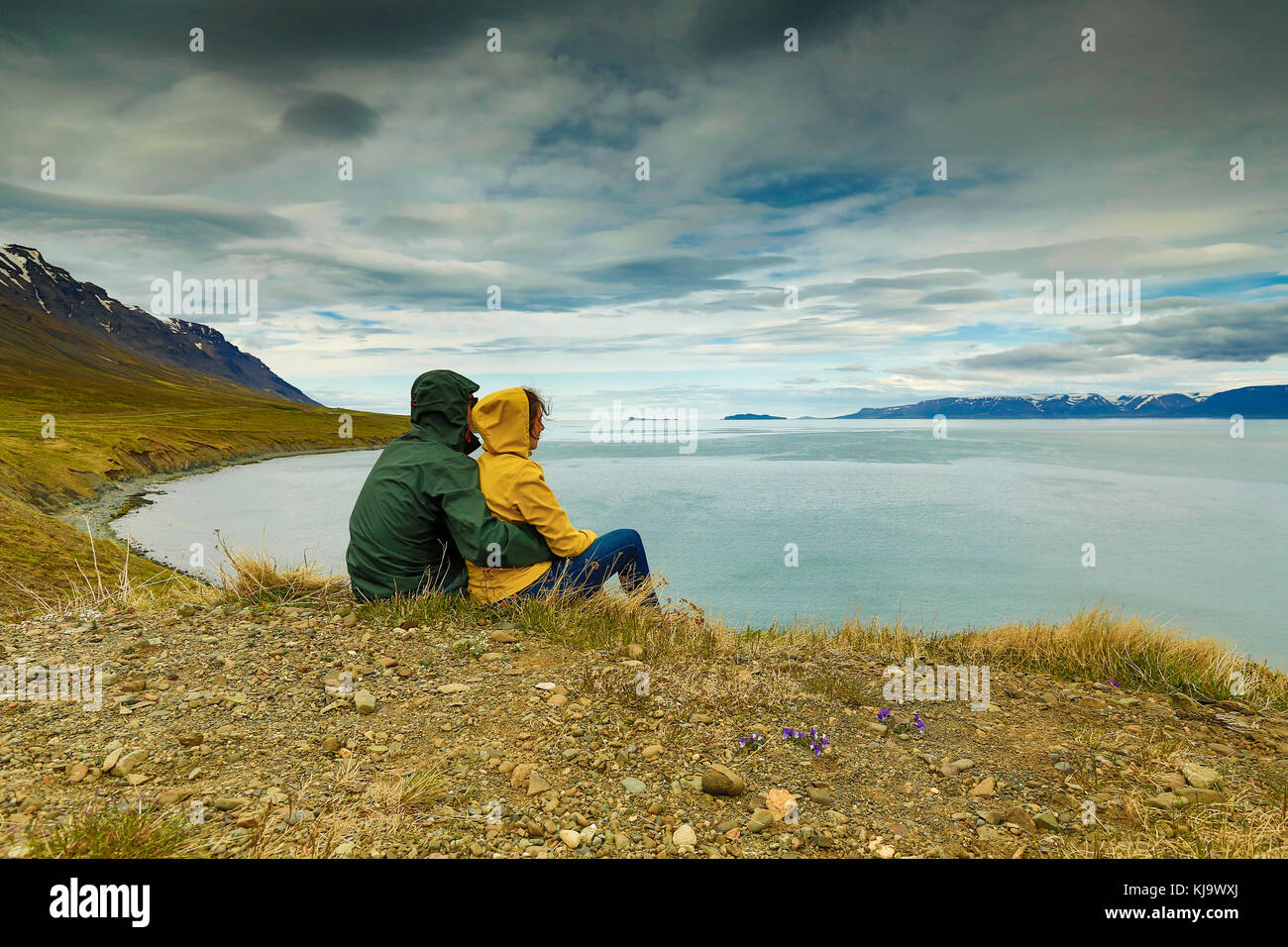 A couple contemplating the beautiful landscape Stock Photo - Alamy