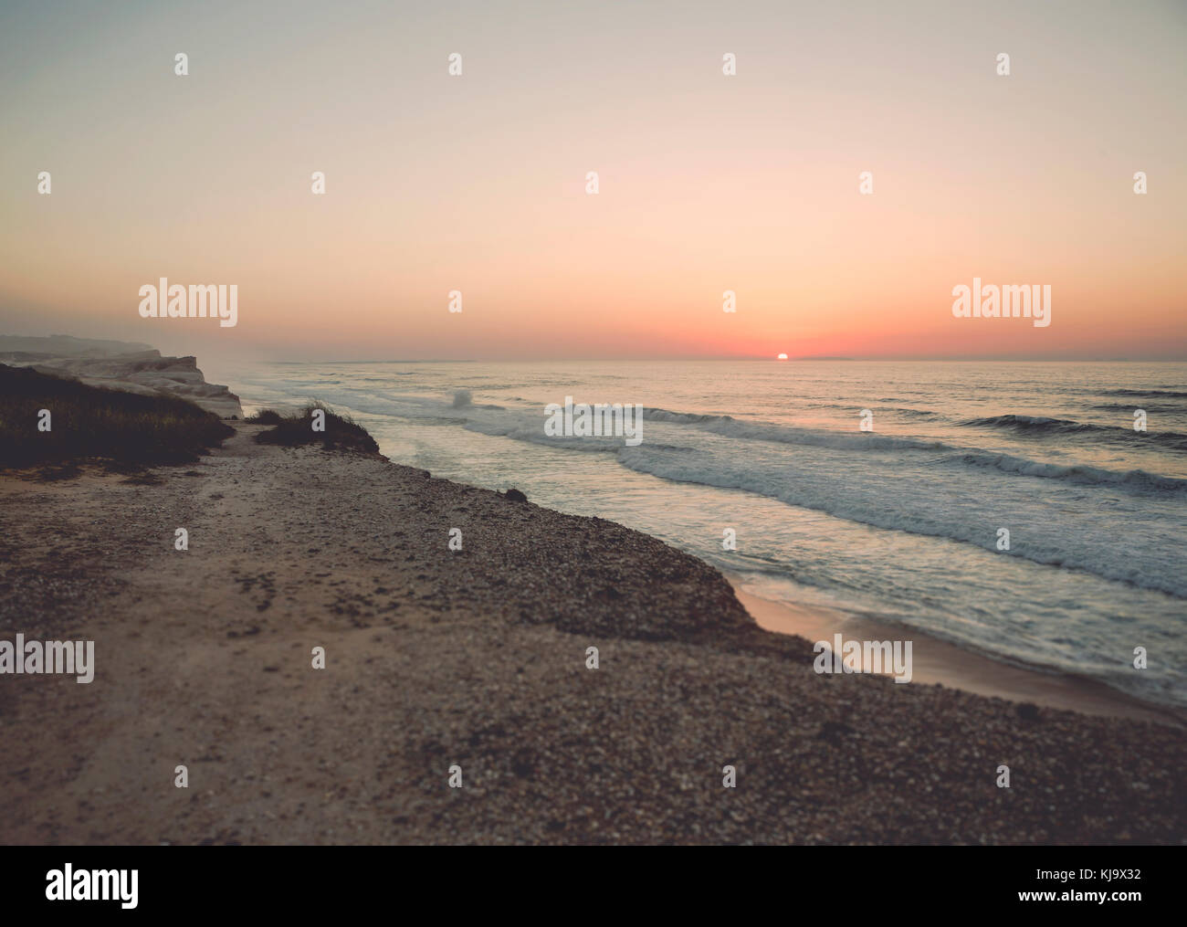 Beautiful orange sunset at the beach Stock Photo - Alamy