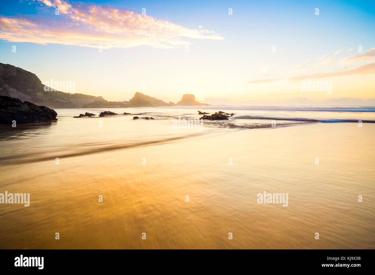 Beautiful orange sunset at the beach Stock Photo - Alamy