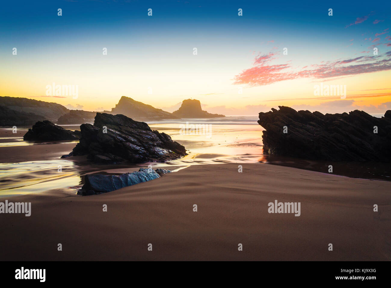 Beautiful orange sunset at the beach Stock Photo - Alamy