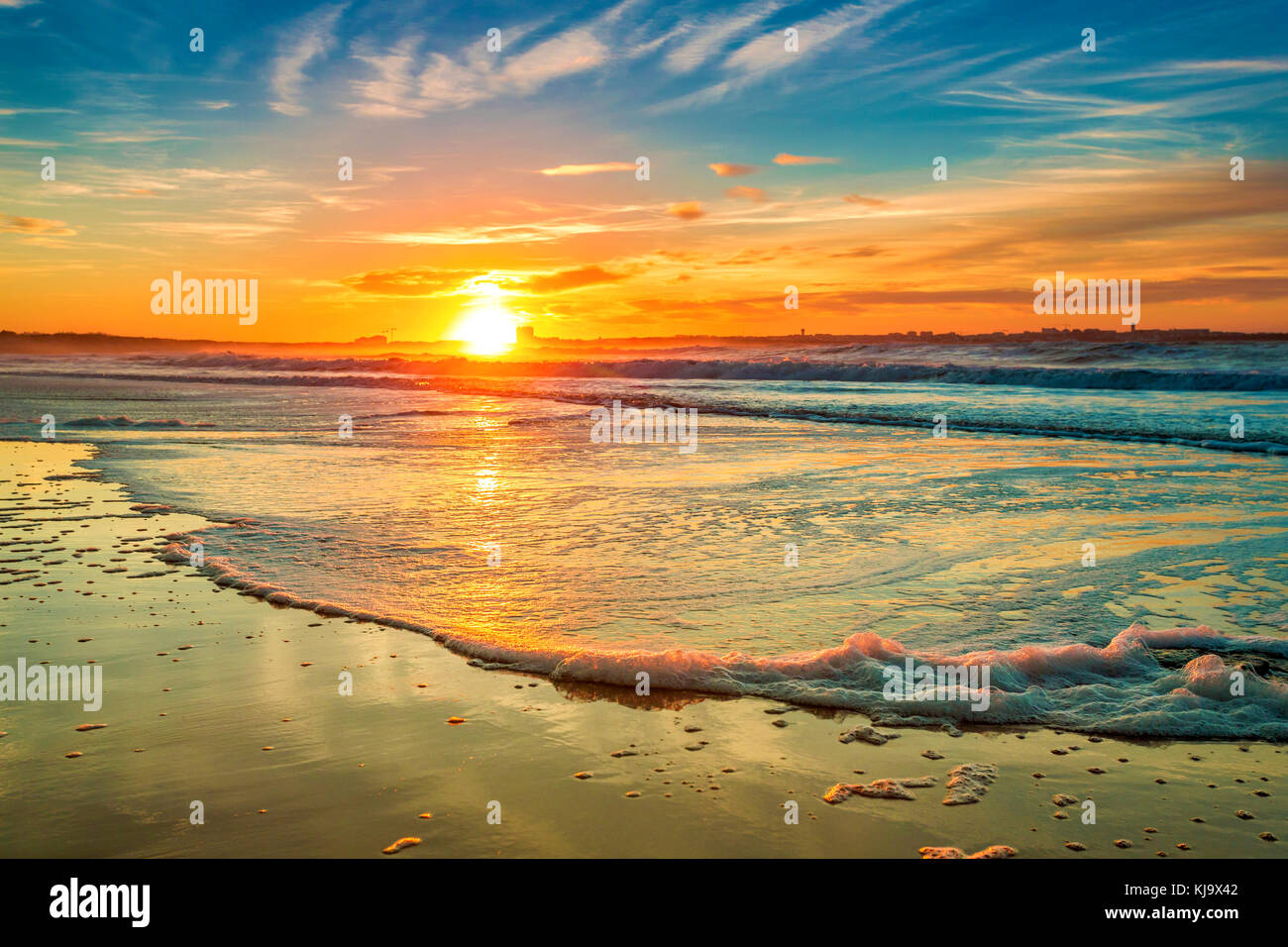 Beautiful orange sunset at the beach Stock Photo - Alamy