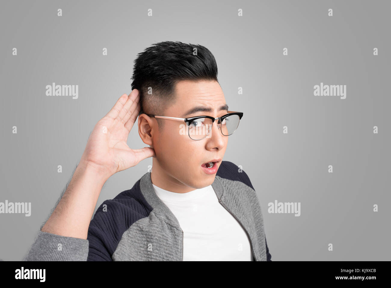 Hand behind ear hi-res stock photography and images - Alamy