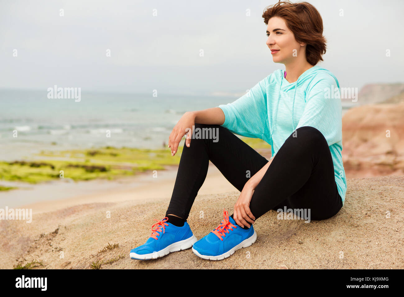 Woman in a relaxed moment after exercise Stock Photo - Alamy