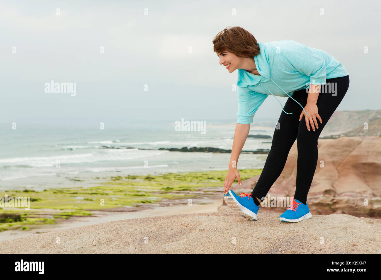 Beautiful athletic woman doing outdoor exercises Stock Photo - Alamy