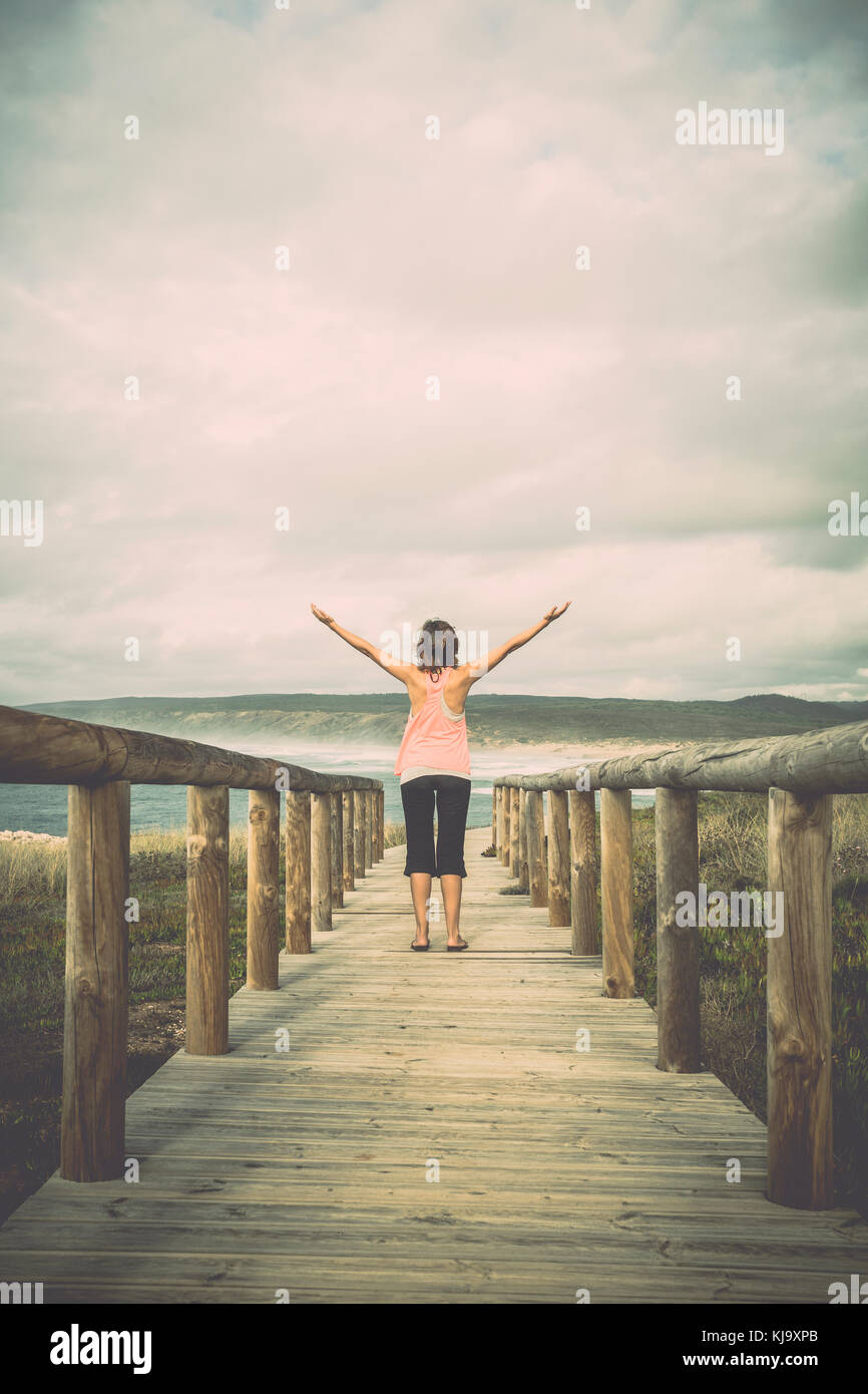 Beautiful young woman enjoying the freedom Stock Photo - Alamy