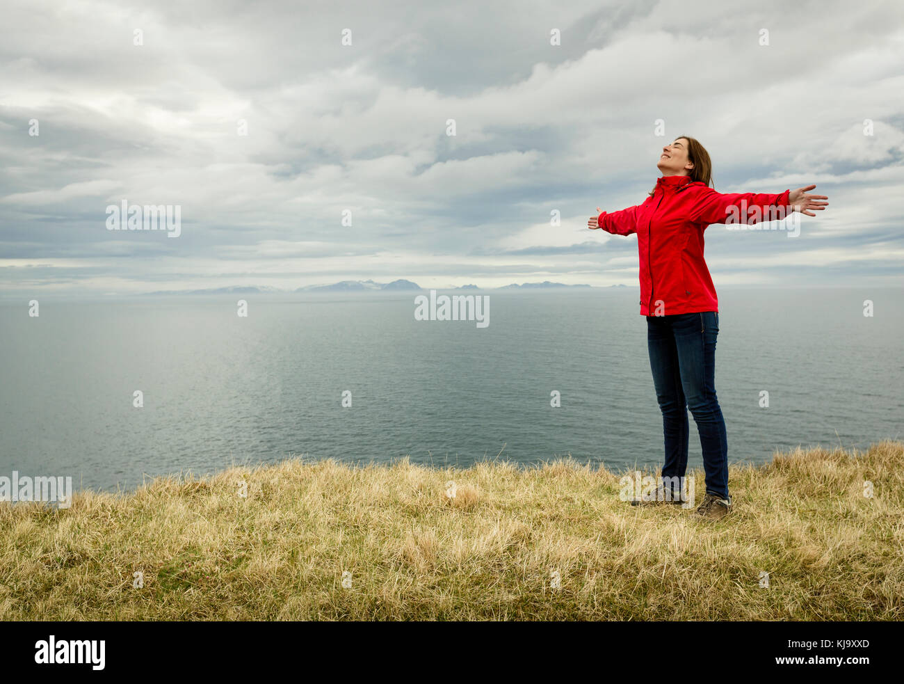 Woman contemplating a beautiful landscape Stock Photo - Alamy