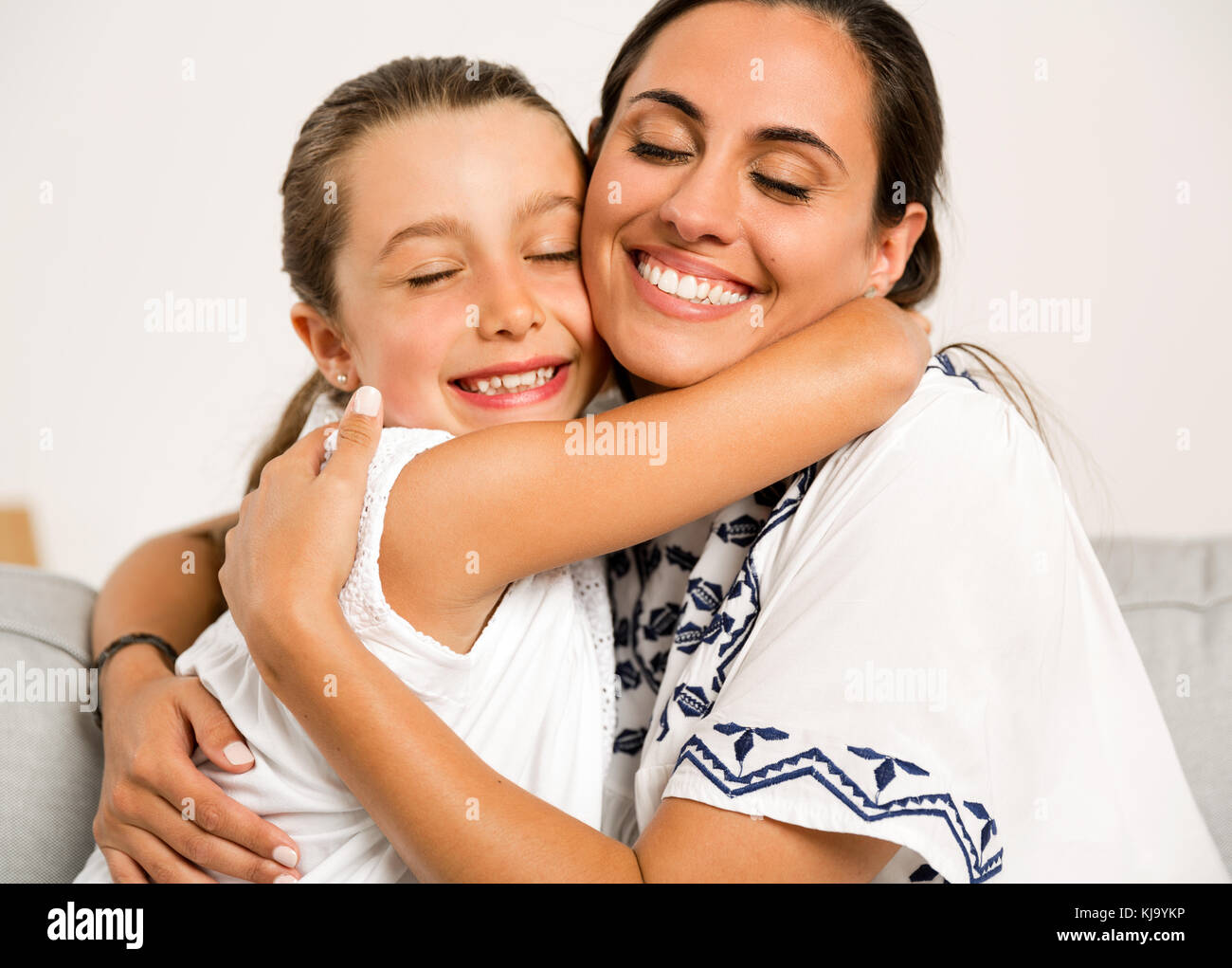 Beautiful Mom and Daughter having fun at home Stock Photo - Alamy