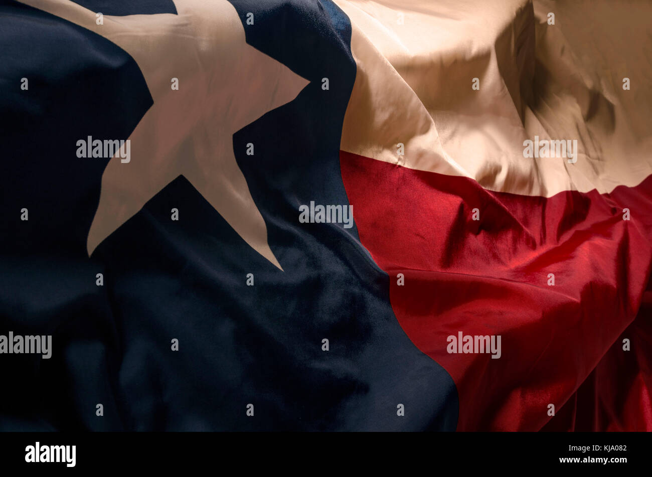 The Lone star flag of Texas in shadow and light Stock Photo - Alamy
