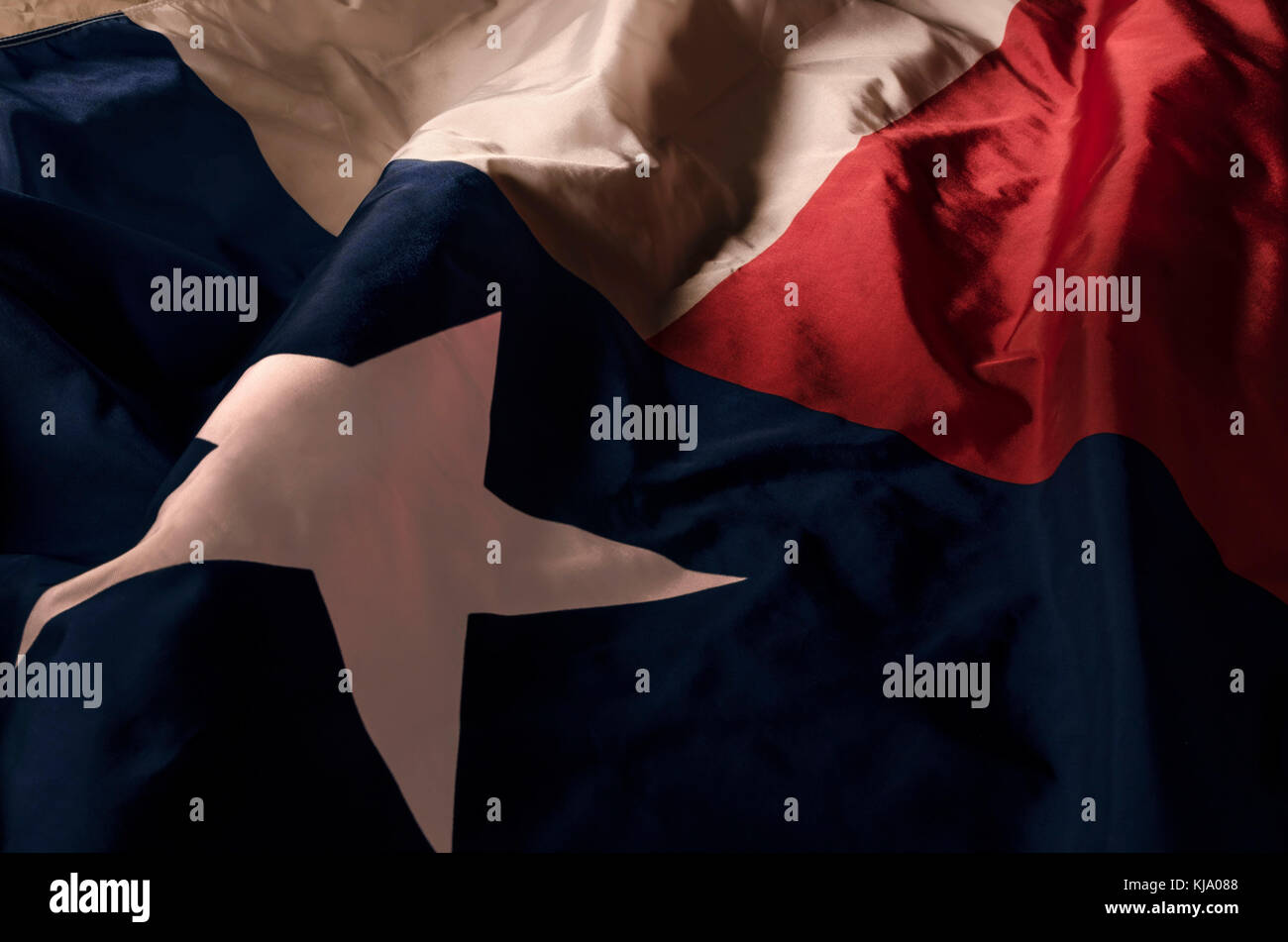 The Lone star flag of Texas in shadow and light Stock Photo - Alamy