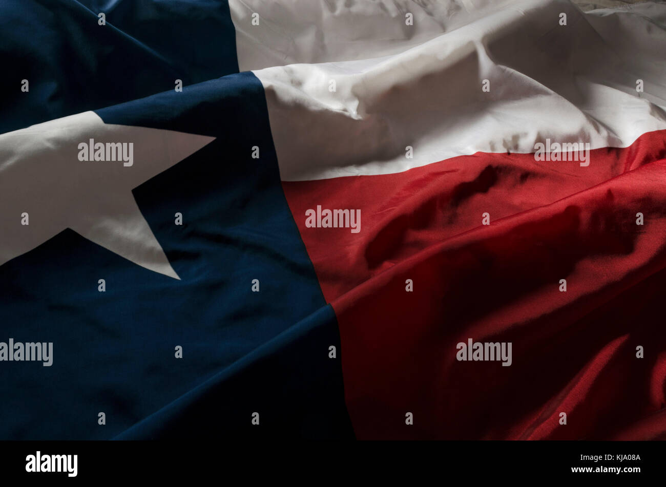 The Lone star flag of Texas in shadow and light Stock Photo - Alamy