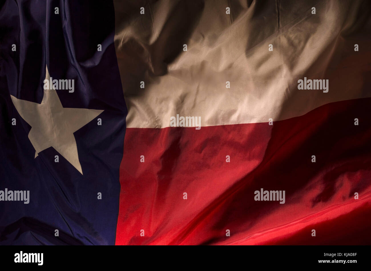 The Lone star flag of Texas in shadow and light Stock Photo - Alamy