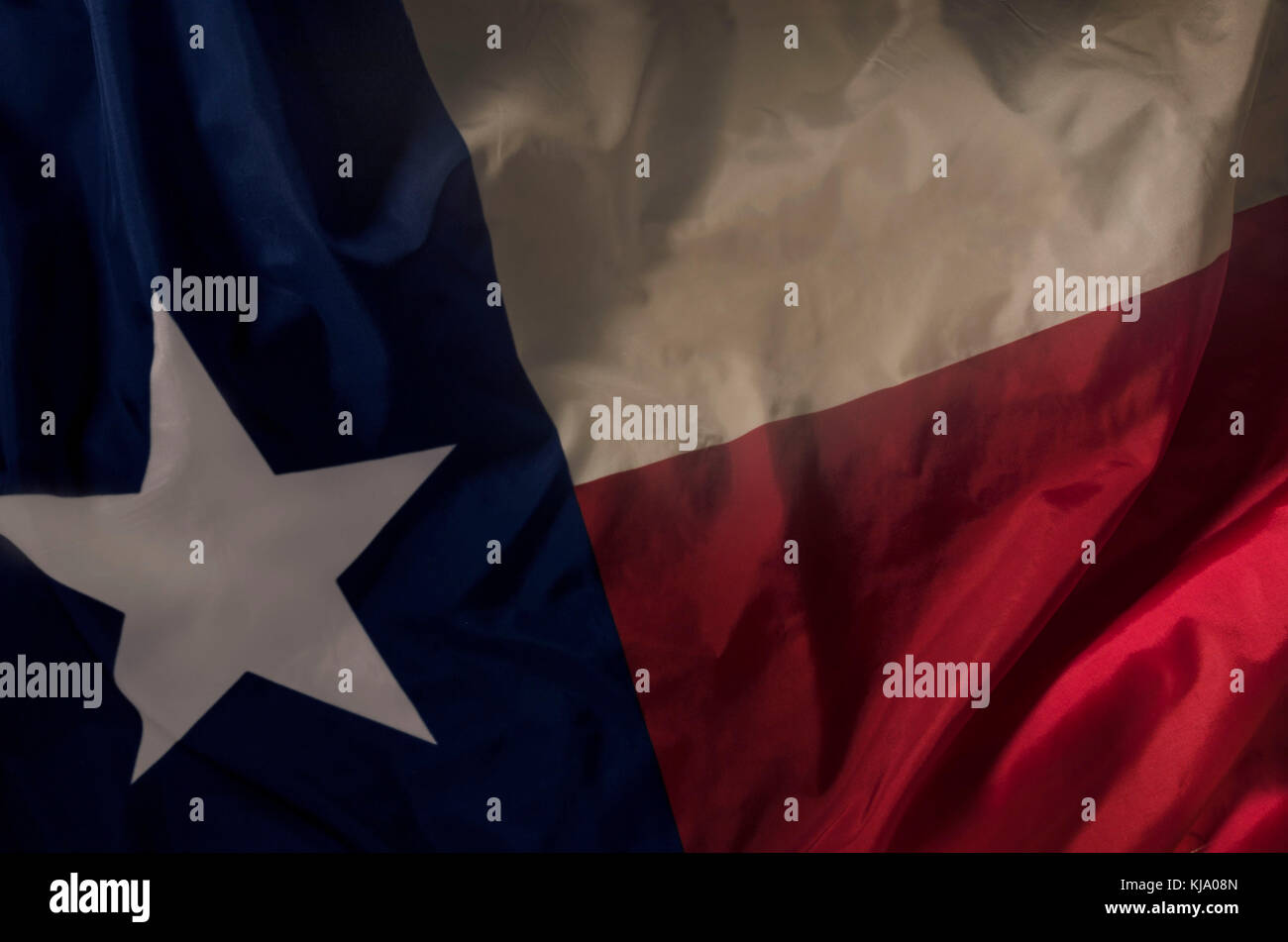 The Lone star flag of Texas in shadow and light Stock Photo - Alamy