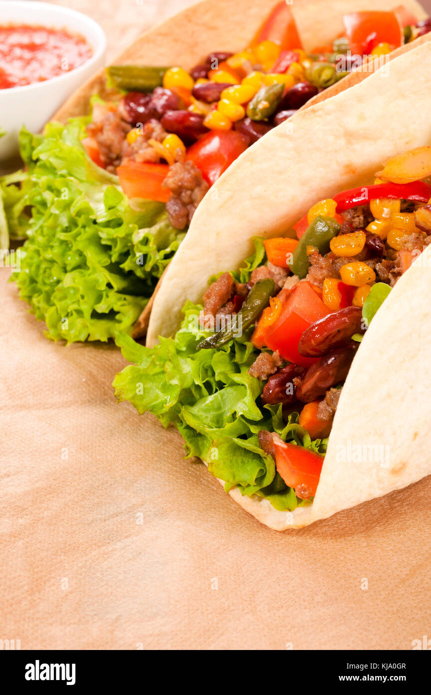 Taco sandwiches on the table. Selective focus on the front taco Stock ...
