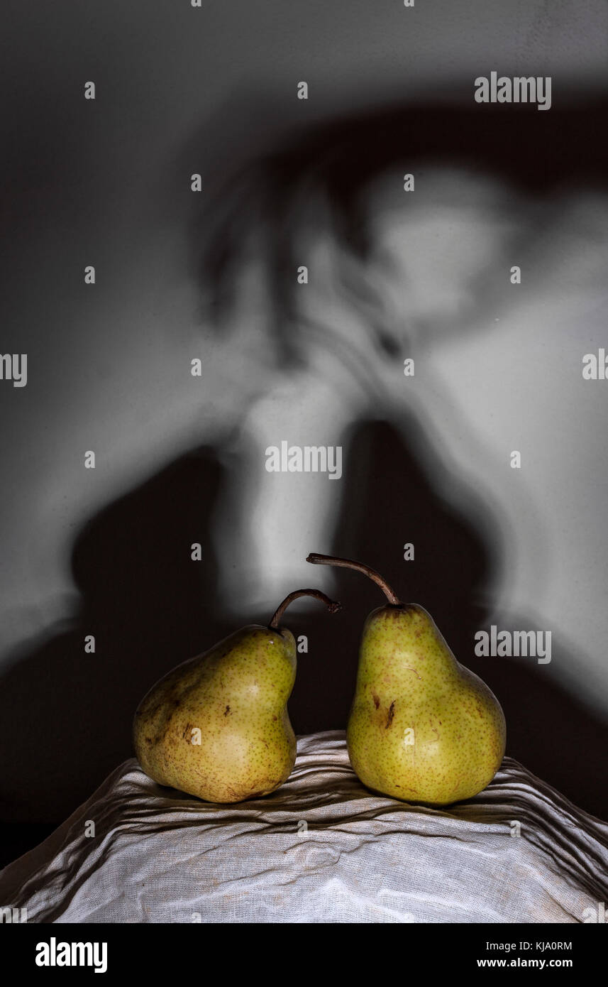 Two pears on hand hi-res stock photography and images - Alamy