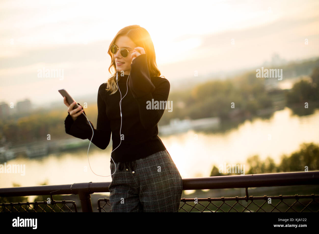 Portrait of attractive young woman with mobile phone outdoor Stock ...