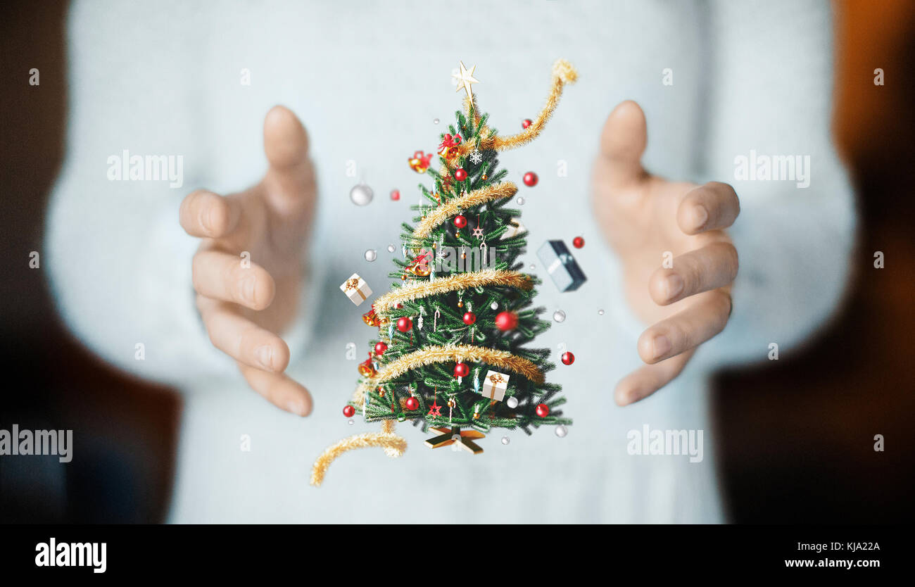 Hand holding christmas tree hi-res stock photography and images - Alamy