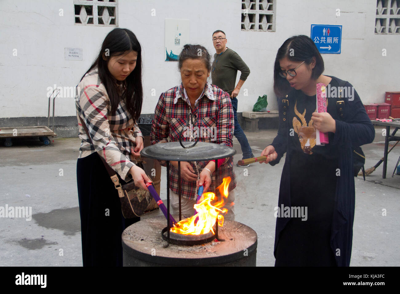 People burn incense at the Jade Buddha Temple in Shanghai, China Stock ...