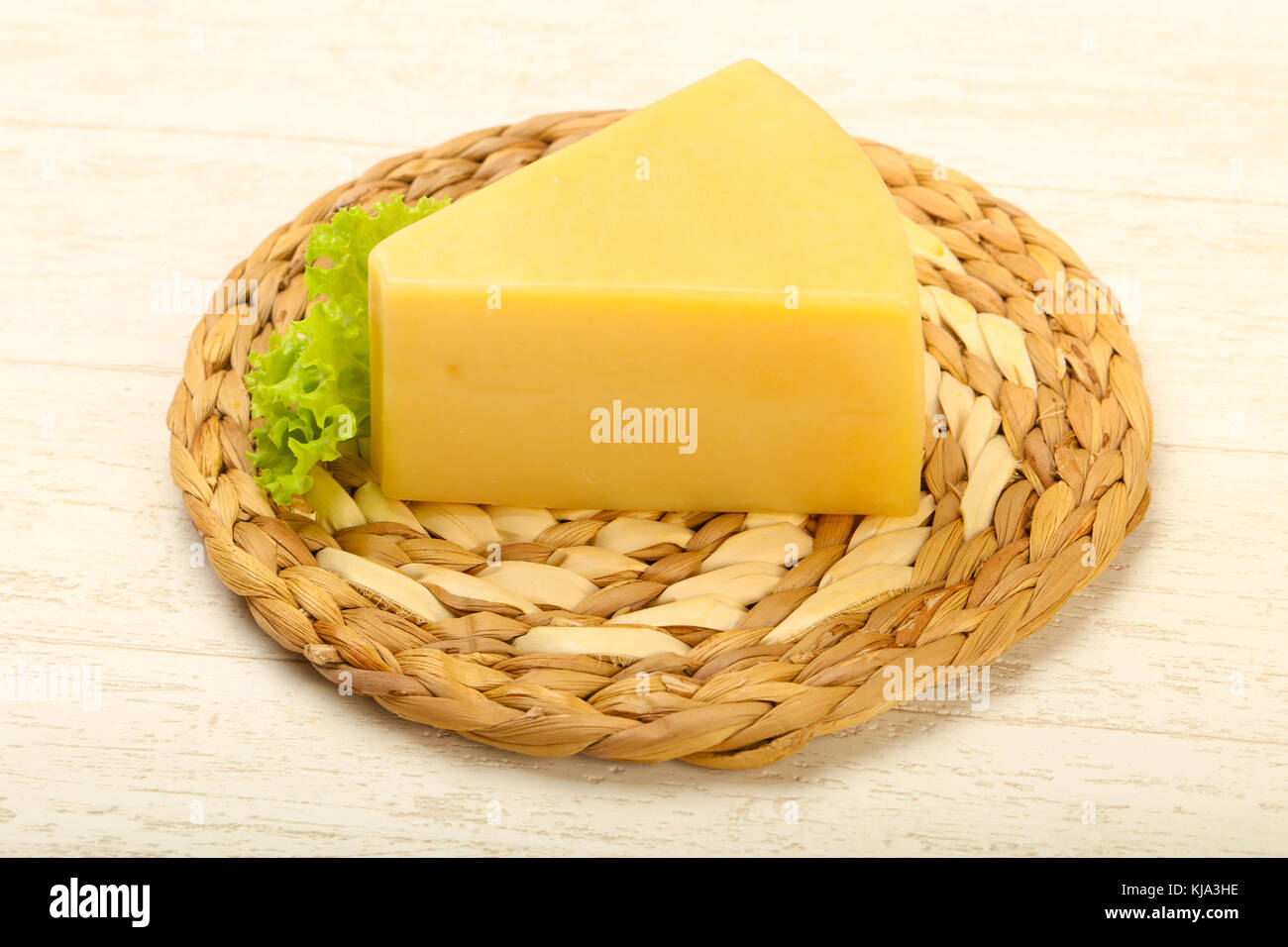Parmesan cheese triangle Stock Photo - Alamy