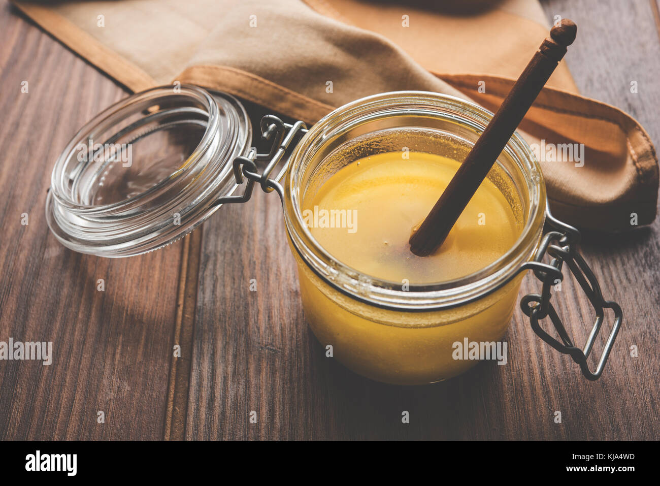 Desi Ghee or clarified butter in glass or Copper container or ceramic ...